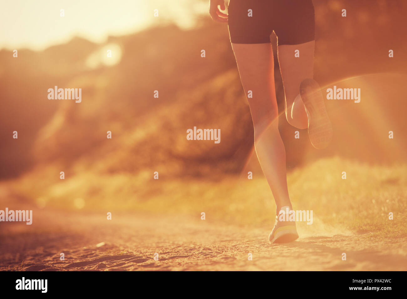 beautiful young woman's legs as she is running in a country road Stock ...