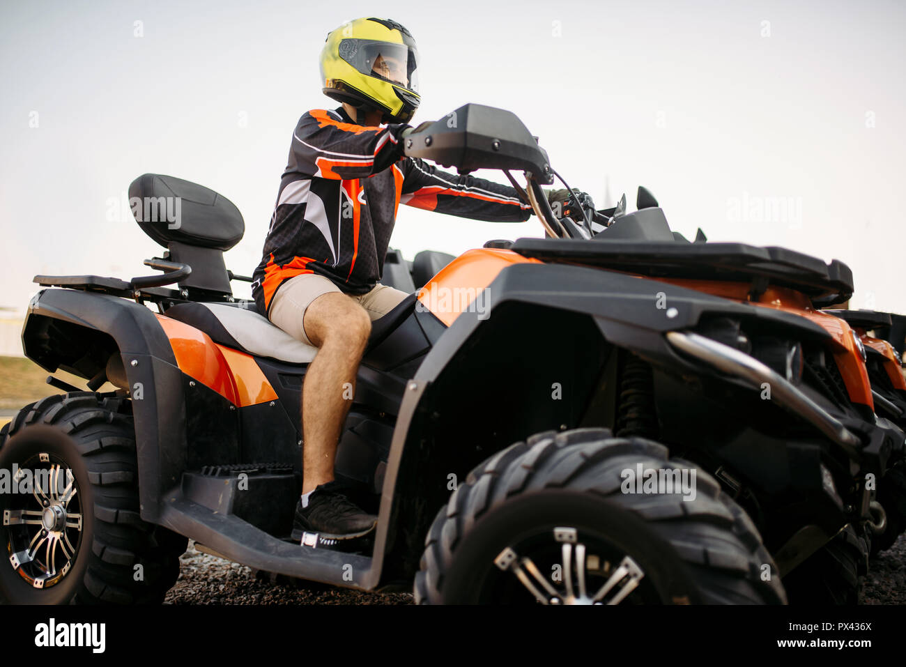 Man on quad with helmet hi-res stock photography and images - Alamy