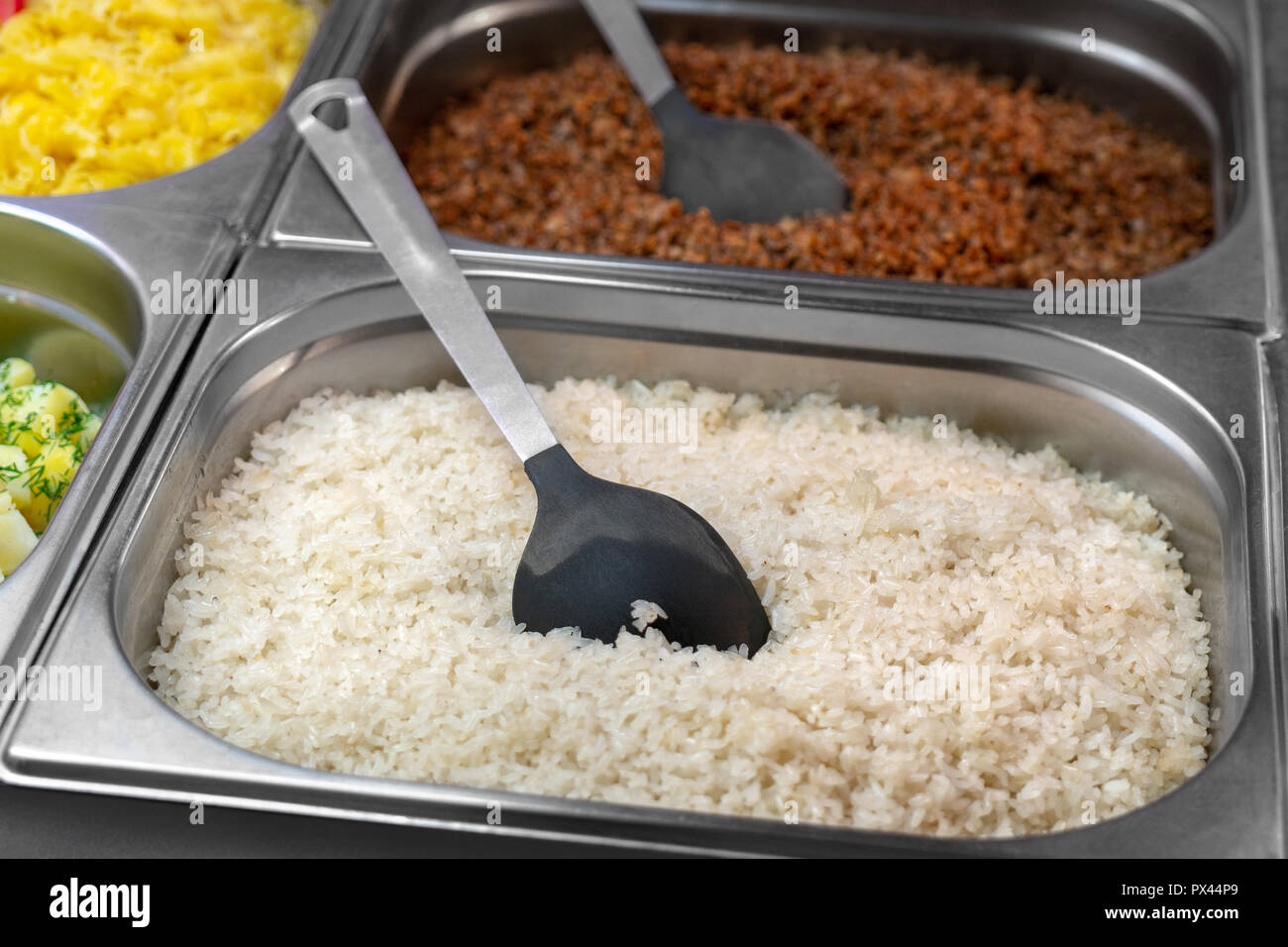 White boiled rice in a metal container.Canteen, catering Stock Photo ...