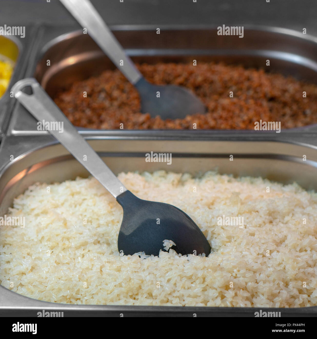 White boiled rice in a metal container.Canteen, catering Stock Photo ...