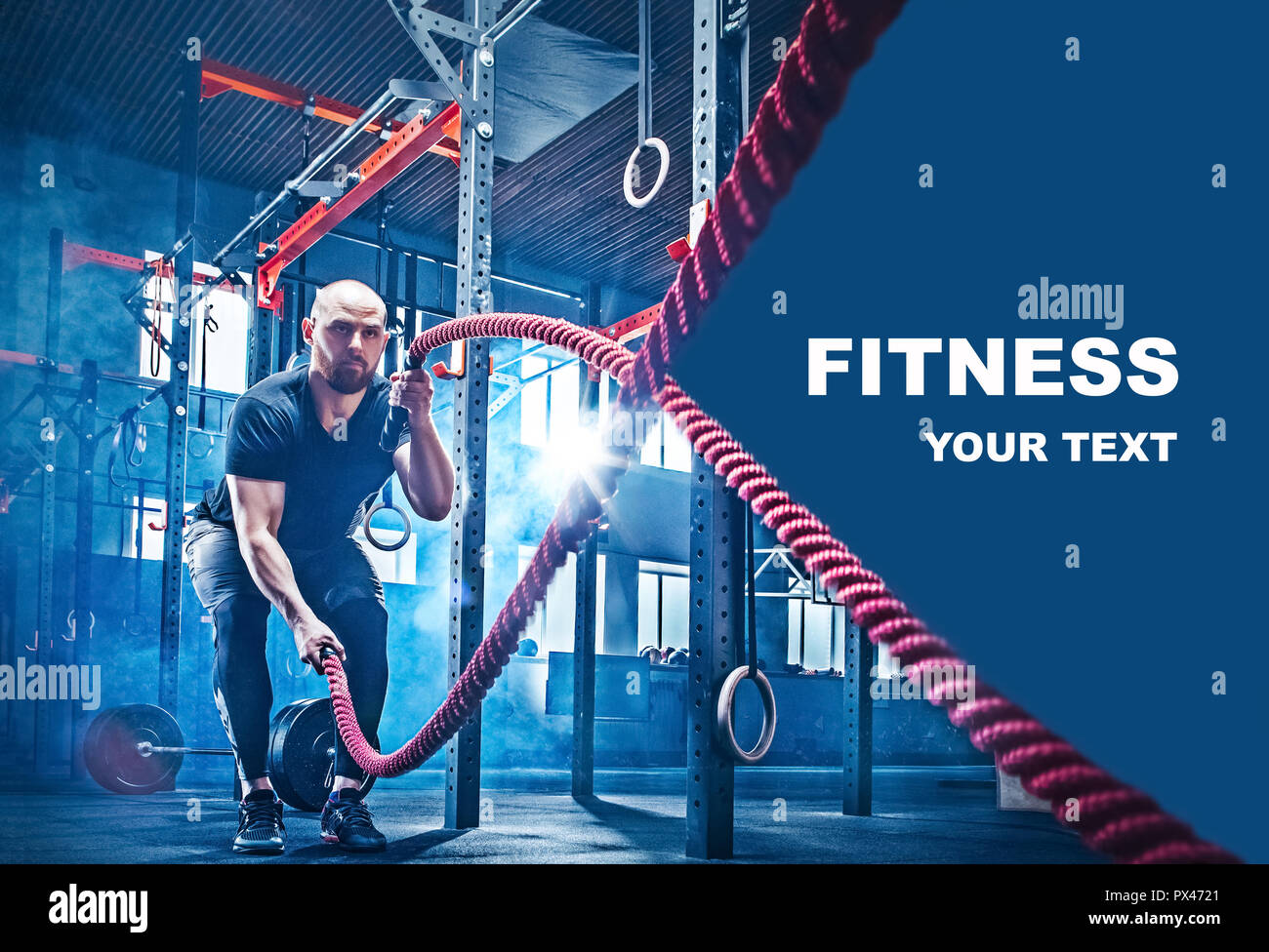 Men with battle rope battle ropes exercise in the fitness gym. CrossFit ...