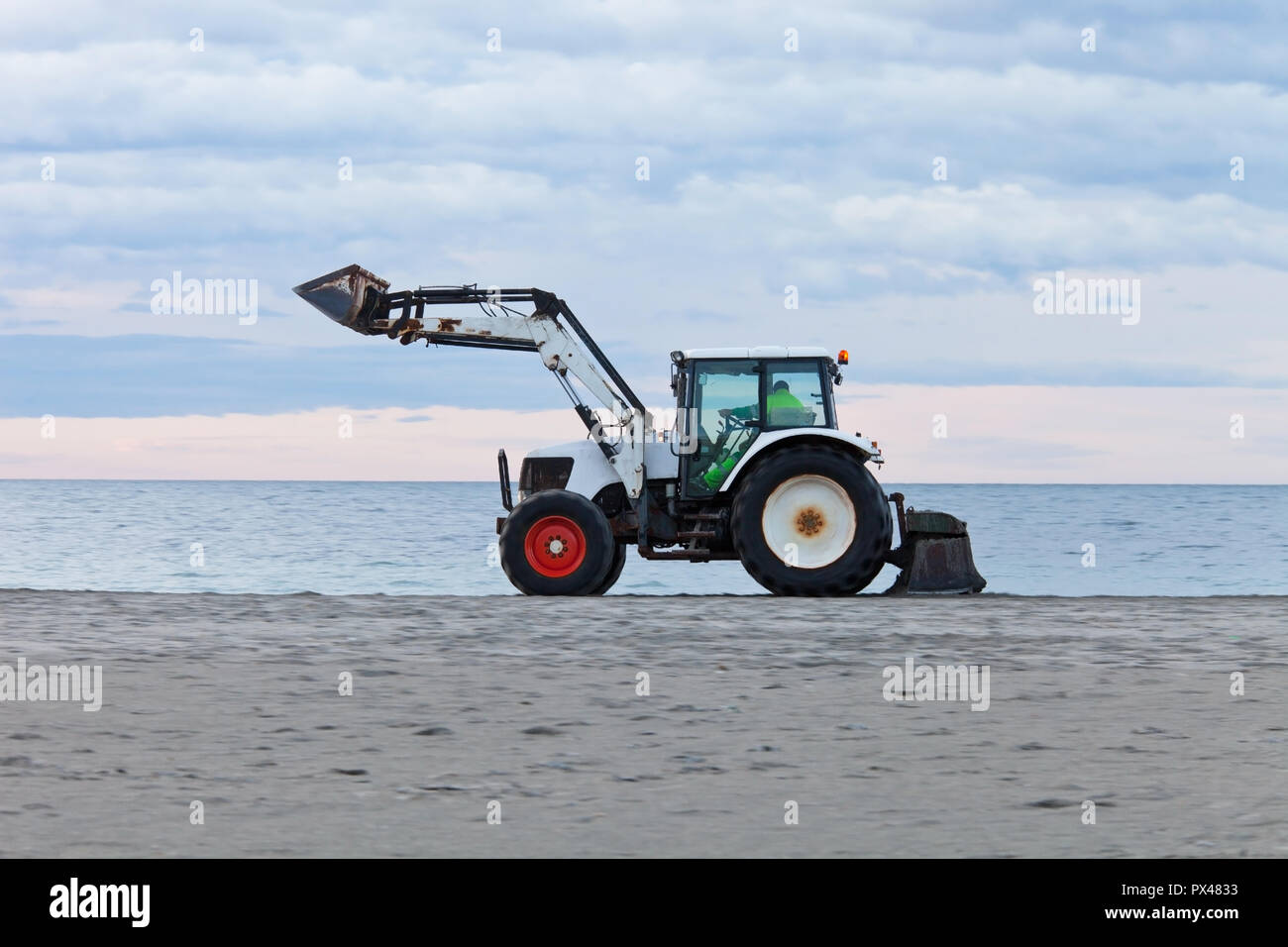 vehicle for cleaning the beach sand Stock Photo - Alamy