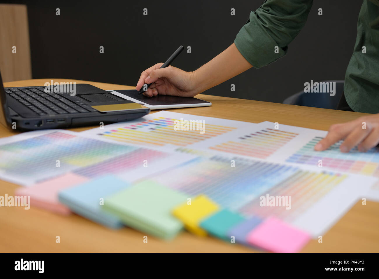 graphic interior designer choosing color from swatch sample. creative ...