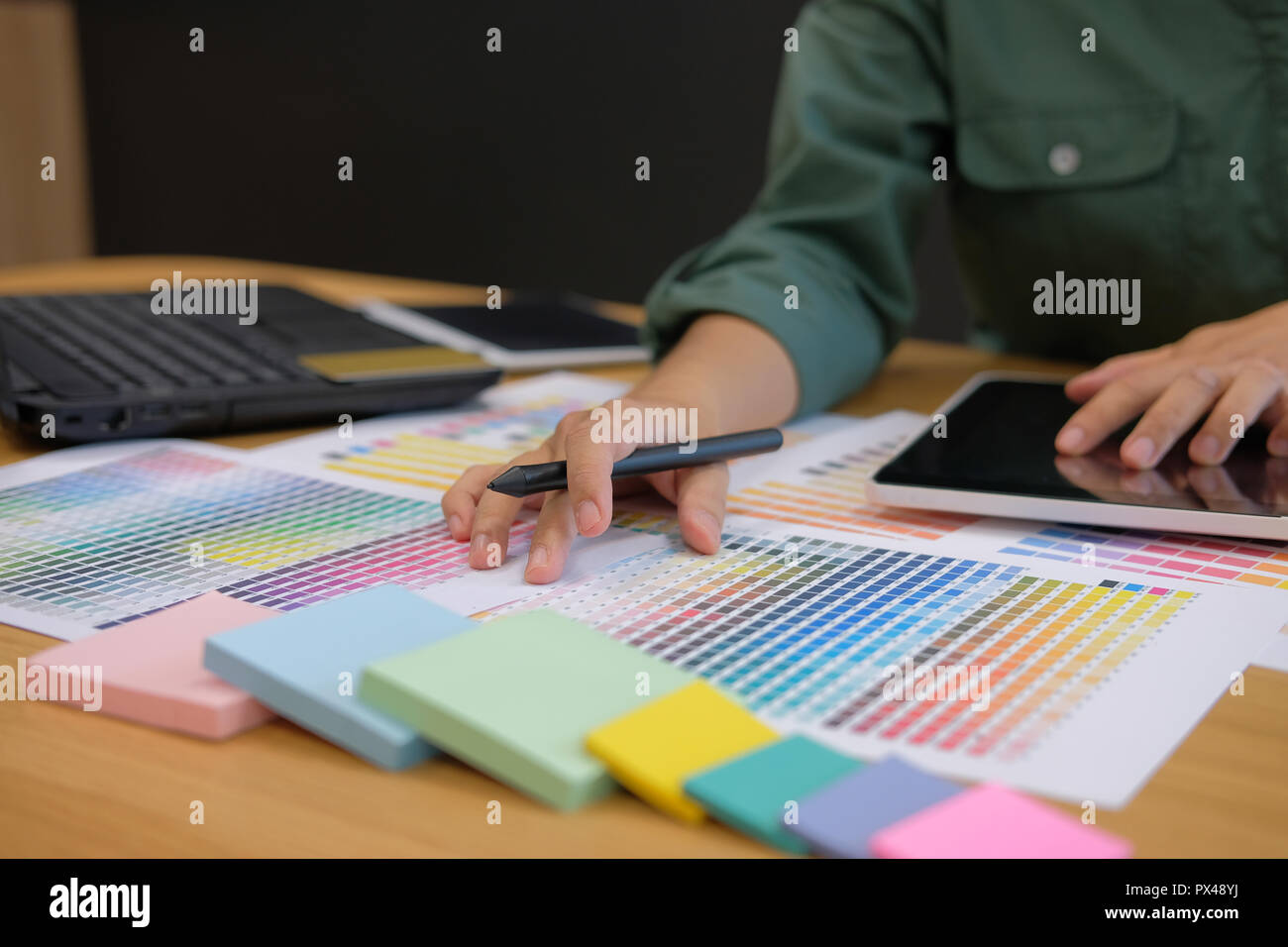 graphic interior designer working with tablet & choosing color from ...