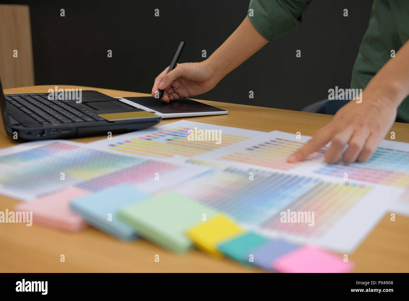 graphic interior designer choosing color from swatch sample. creative ...