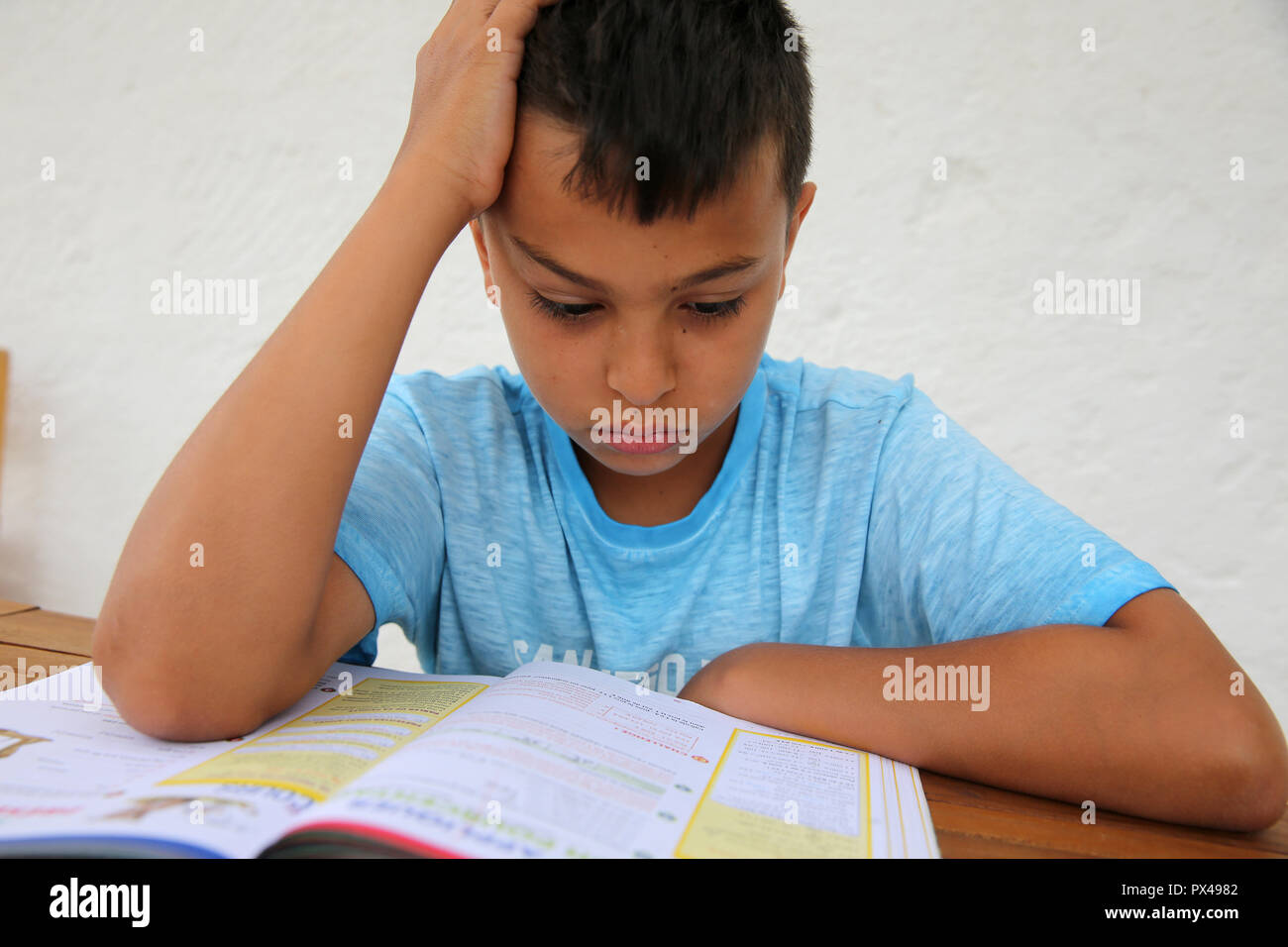 11-year-old boy doing homework in Salento, Italy Stock Photo - Alamy