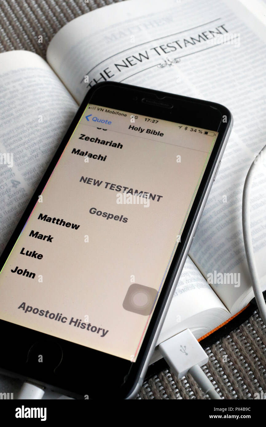 Paper Bible and digital Bible app on smartphone Stock Photo - Alamy