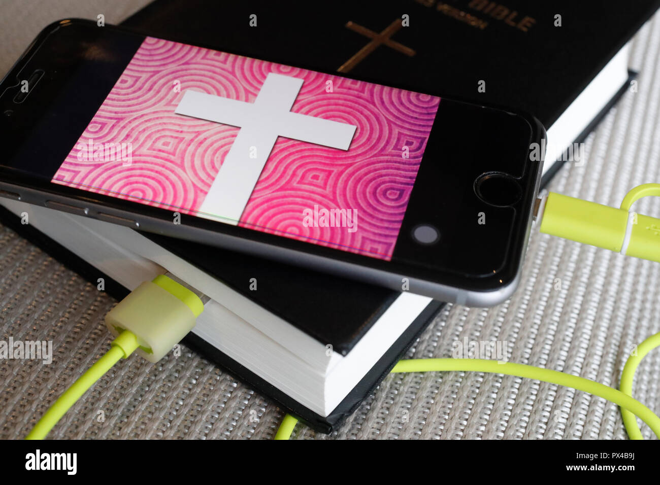 Paper Bible and digital Bible app on smartphone Stock Photo - Alamy