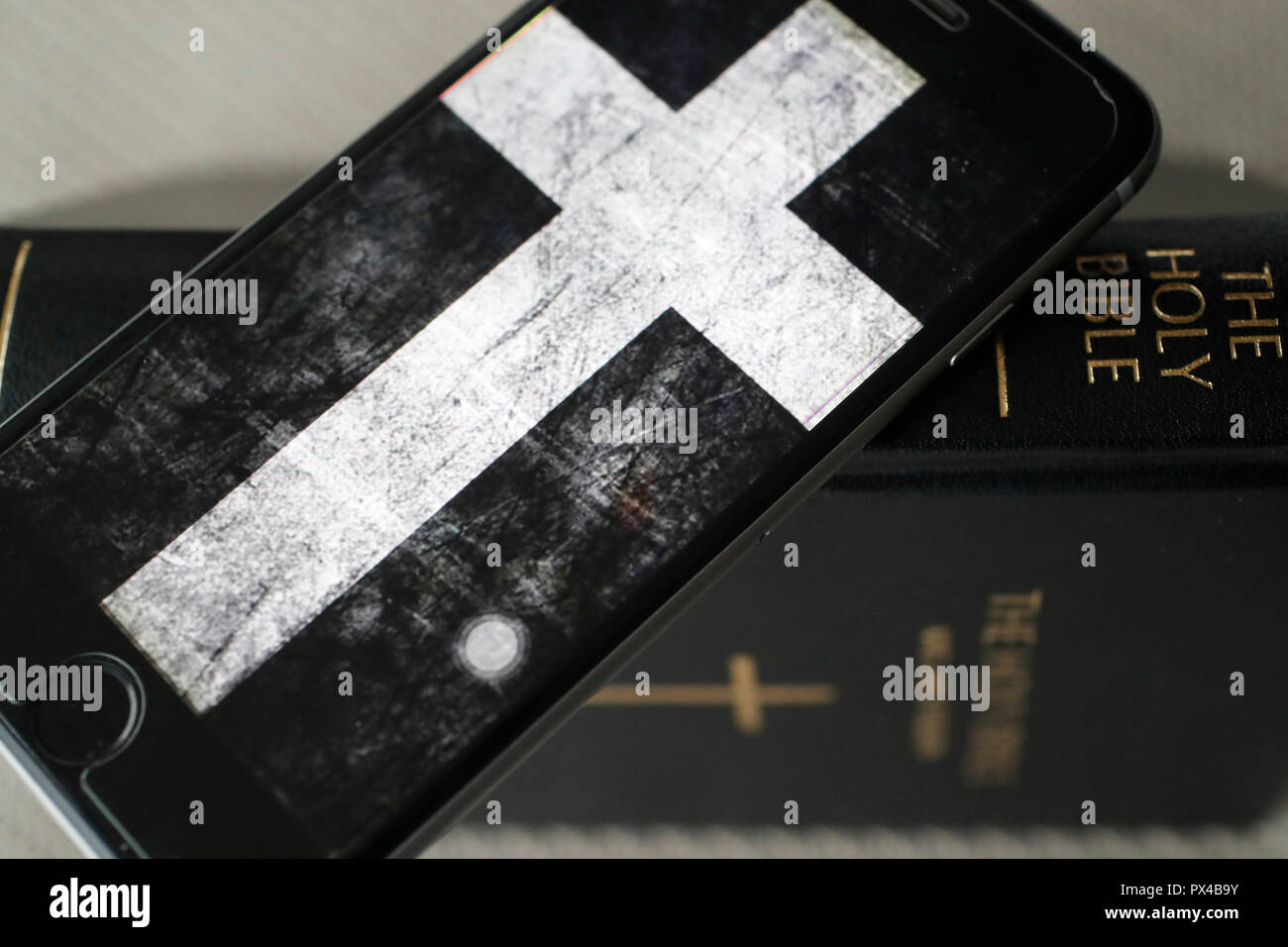 Paper Bible and digital Bible app on smartphone Stock Photo - Alamy