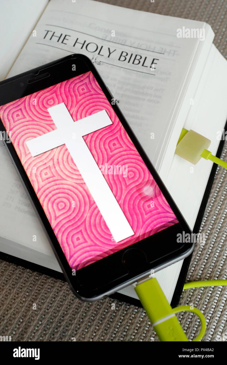 Paper Bible and digital Bible app on smartphone Stock Photo - Alamy