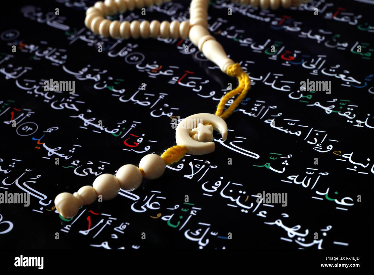 Electronic Quran on a tablet and prayer beads Stock Photo - Alamy