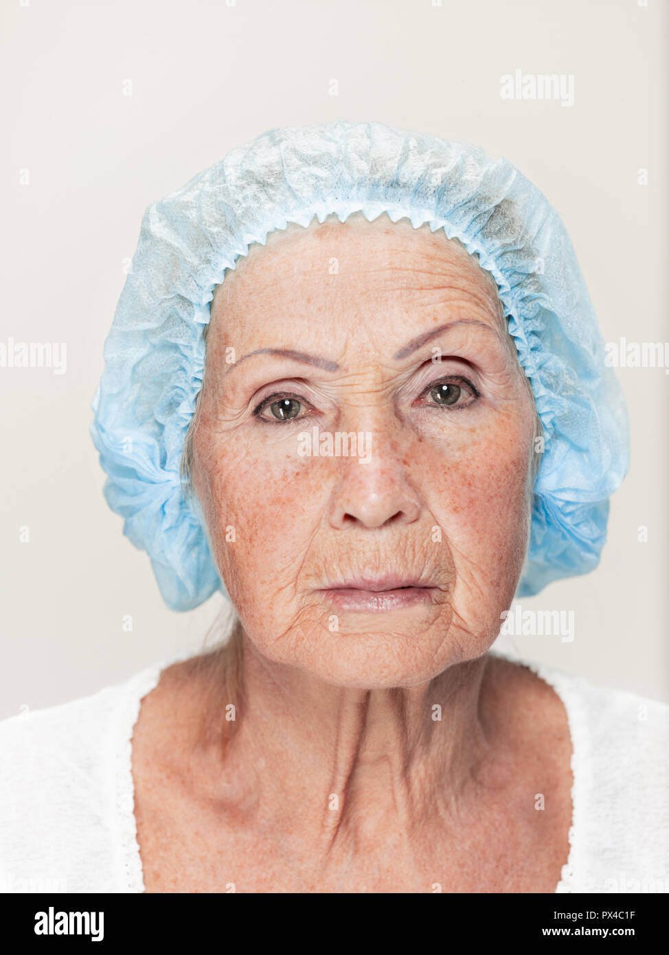 The face of mid age woman before plastic surgery. Senior female model ...