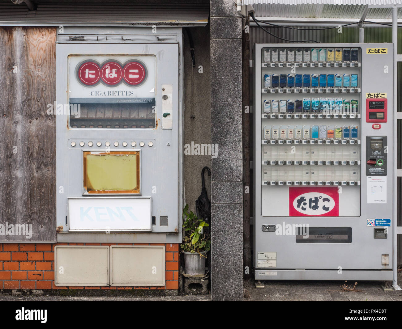 2 two cigarette vending machines, and an umbrella, suburban ...