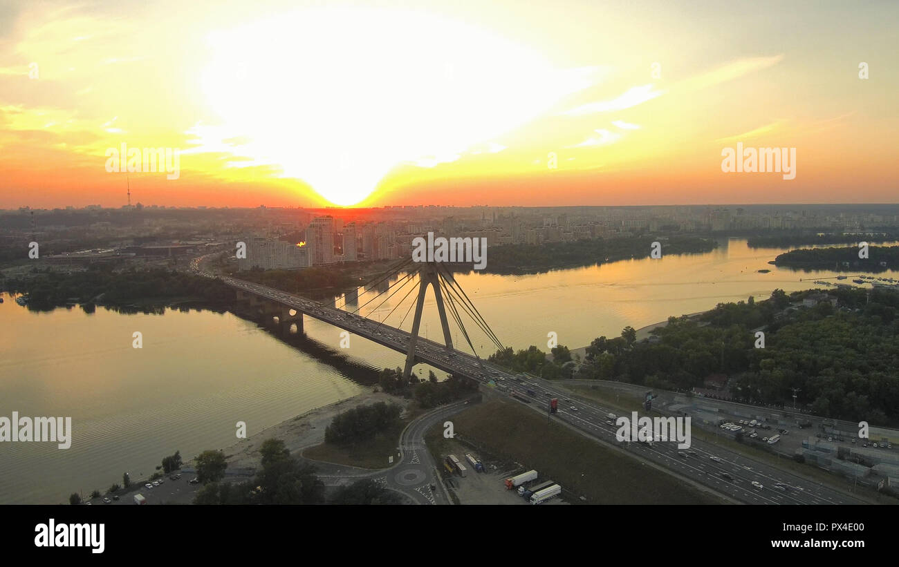 Aerial Drone Flight: View of the bridge over the river with cars Stock ...