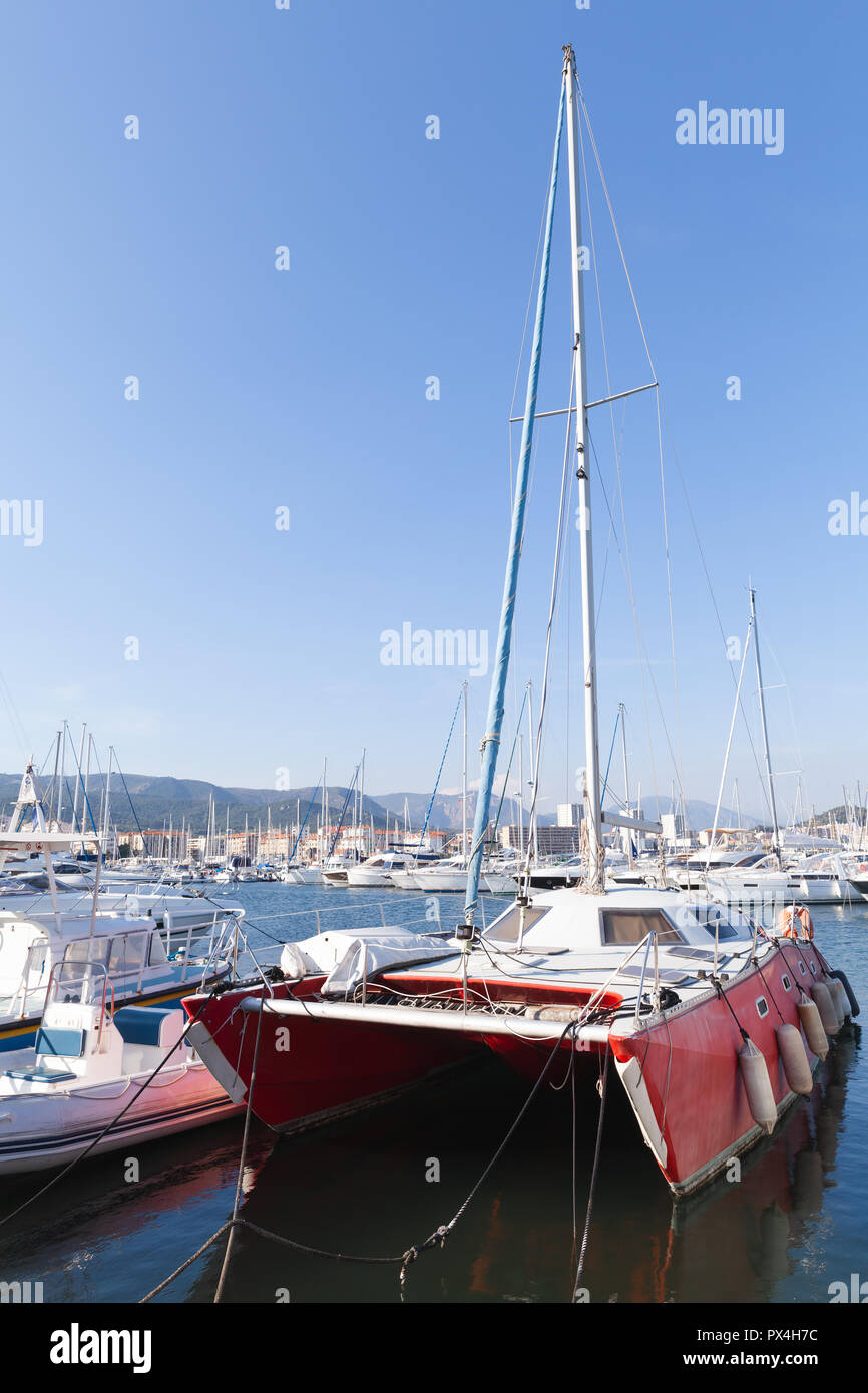 Red catamaran yacht moored in marina of Ajaccio. Corsica, French island ...
