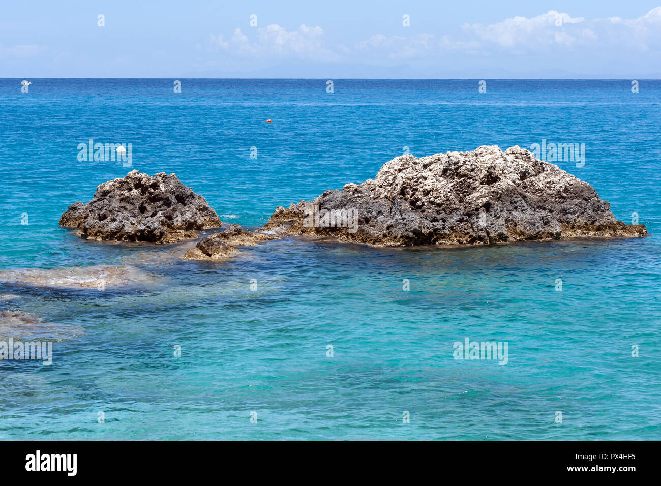 Rocks in the Blue waters of Ionian sea, near Agios Nikitas village ...