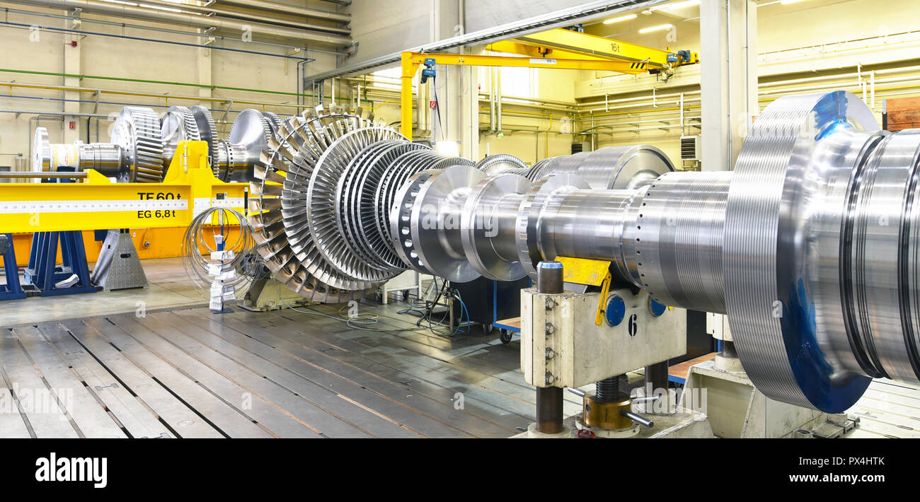 assembling and constructing gas turbines in a modern industrial factory ...