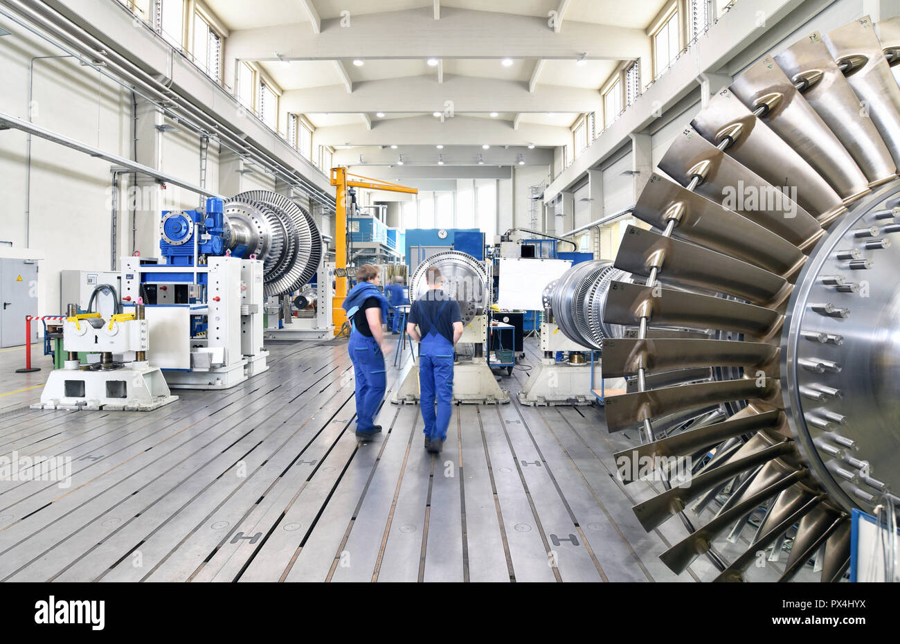 workers manufacturing steam turbines in an industrial factory Stock ...