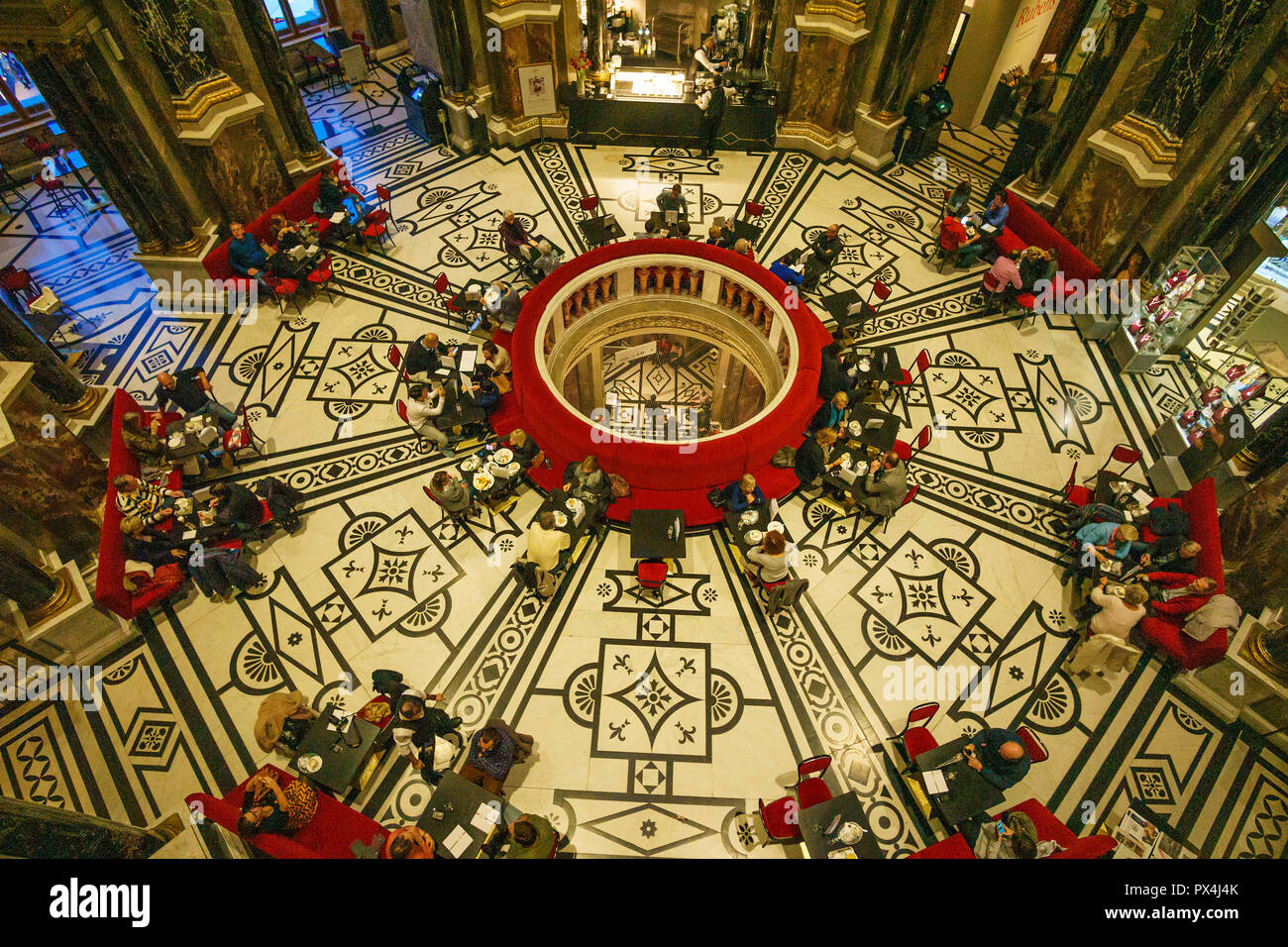 Tourists and visitors relaxing and drinking inside the ancient bar of ...