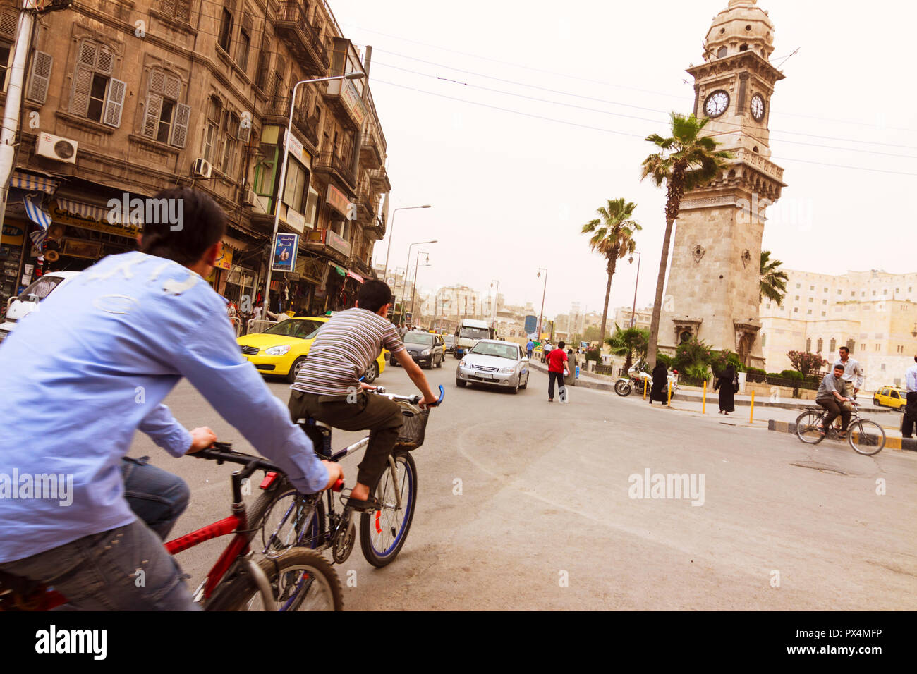 Aleppo, Aleppo Governorate, Syria : People cycles past the baroque ...
