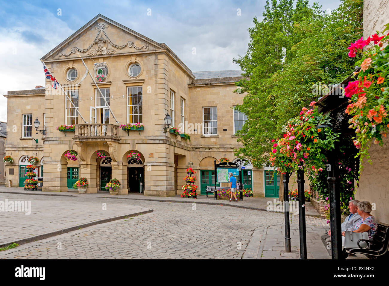 Colourful floral decorations adorn the imposing Town Hall in the Market ...