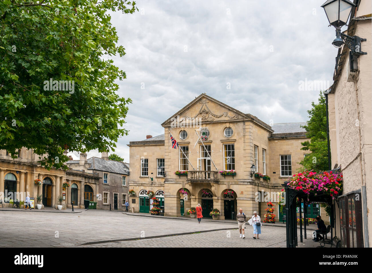 Colourful floral decorations adorn the imposing Town Hall in the Market ...