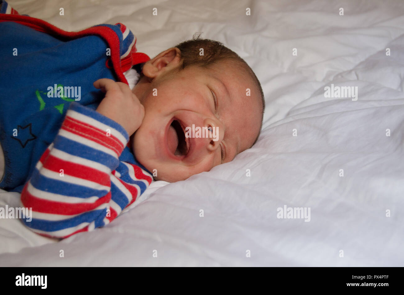 Cute Baby Smiling While Sleeping