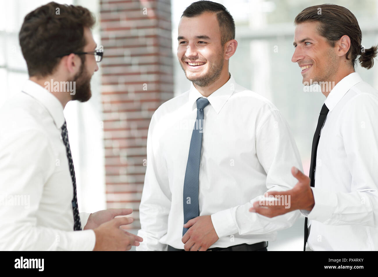 employees are talking ,standing in the office.photo with copy space ...