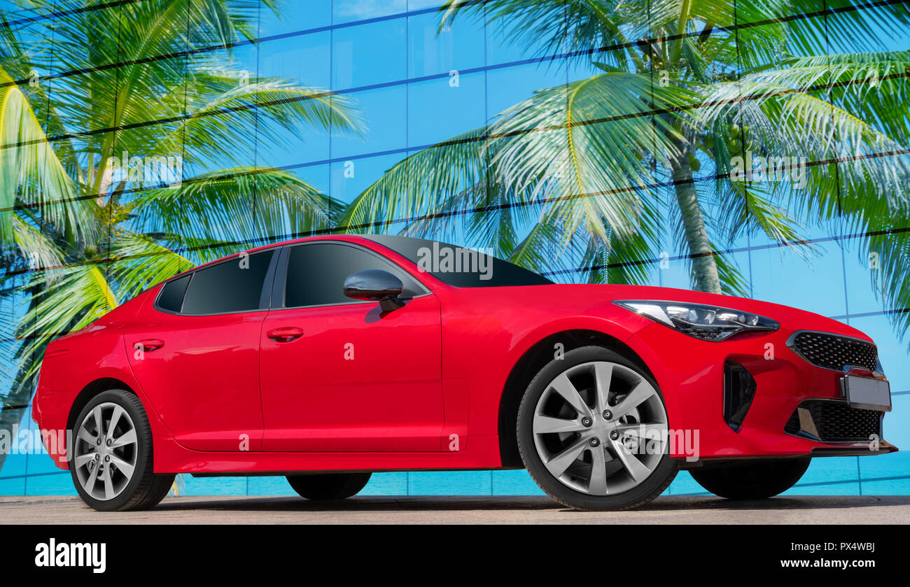 Red car on a background of palm trees. Stylish, modern, bright image of ...