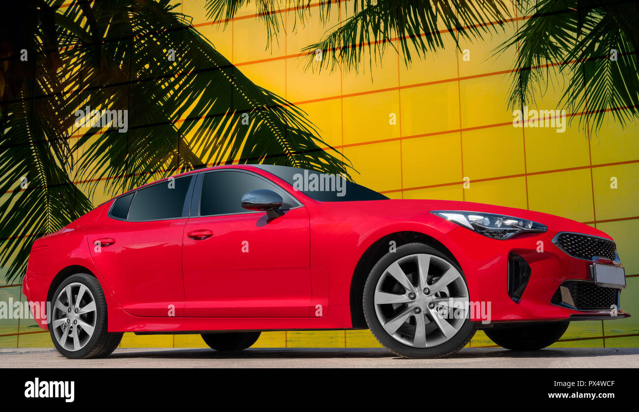 Red car on a background of palm trees. Stylish, modern, bright image of ...