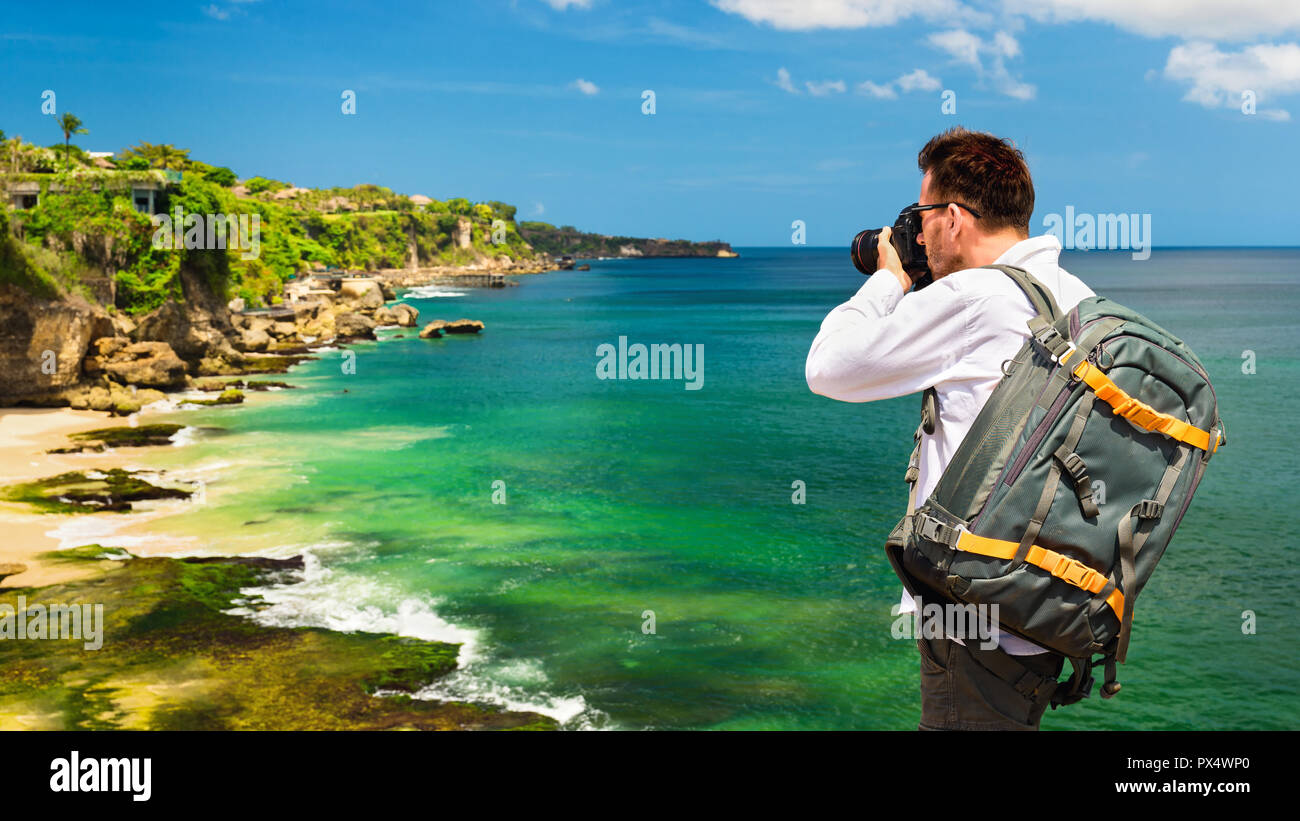 Travel photographer with backpack and camera in hand make photo nature ...