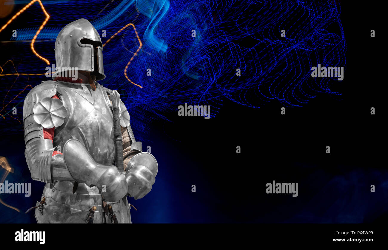 Knight in helmet and metal armor Stock Photo - Alamy