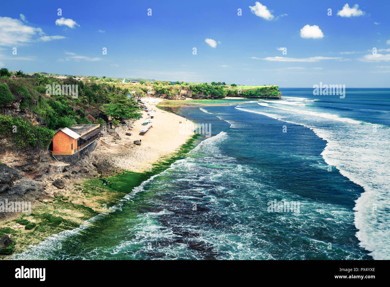 Azure beach with rocky mountains and clear water of Indian ocean at ...