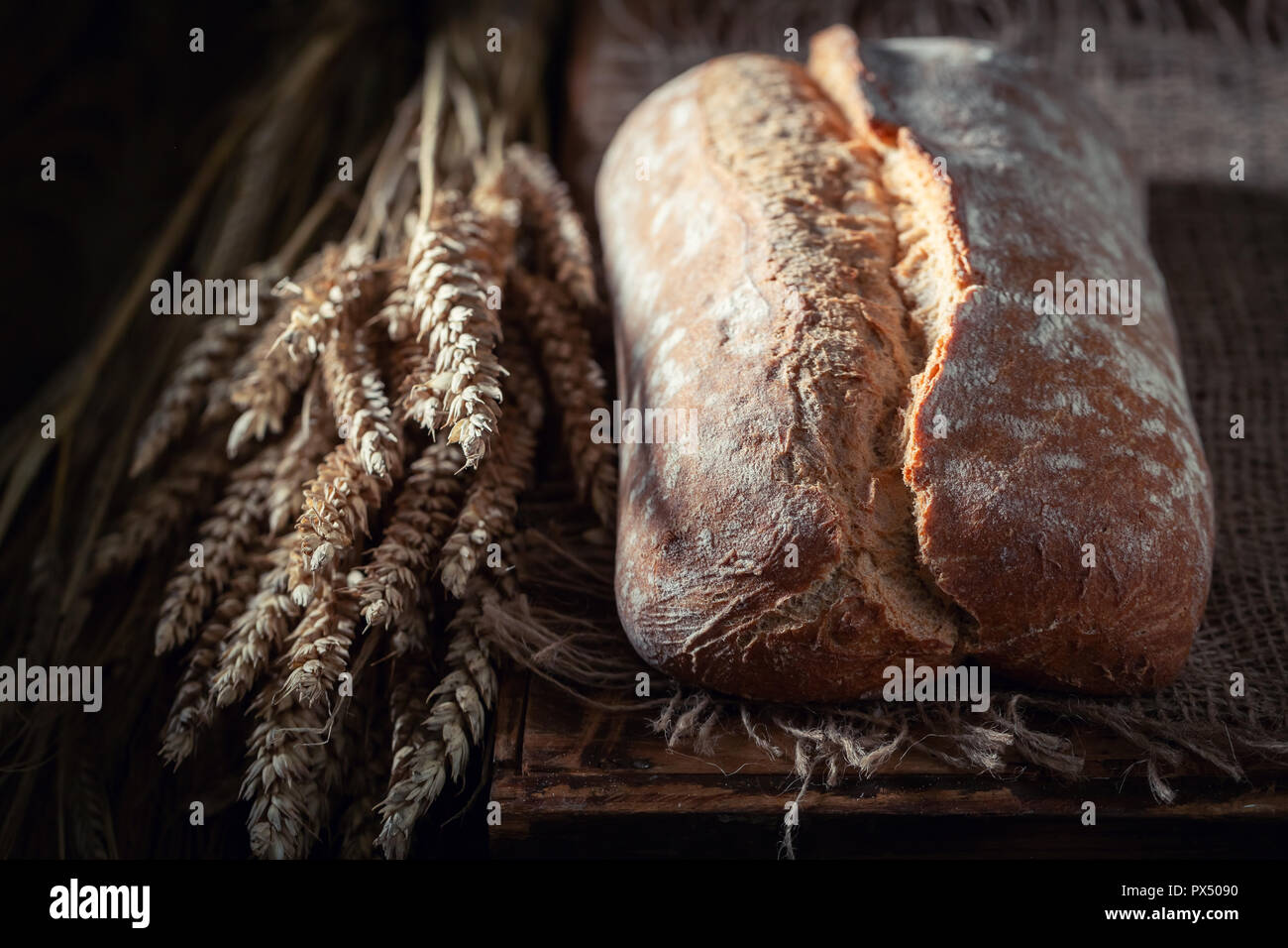 Homemade loaf of bread in rustic kitchen Stock Photo - Alamy