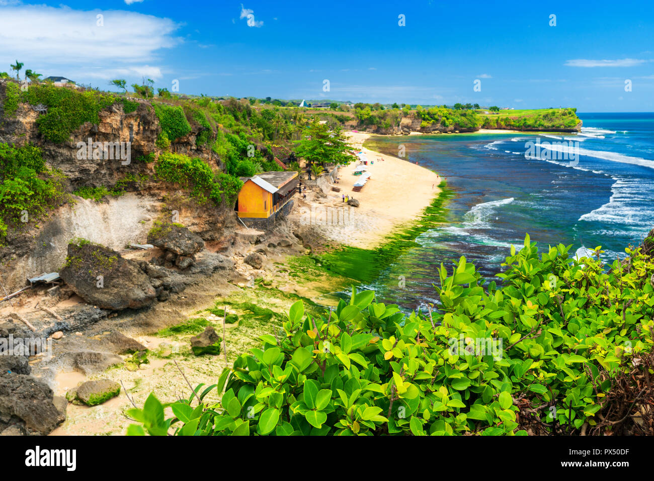 Azure beach with rocky mountains and clear water of Indian ocean at ...