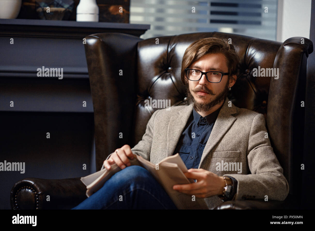 Young man reading a newspaper Stock Photo - Alamy Young man reading a newspaper Stock Photo - Alamy
