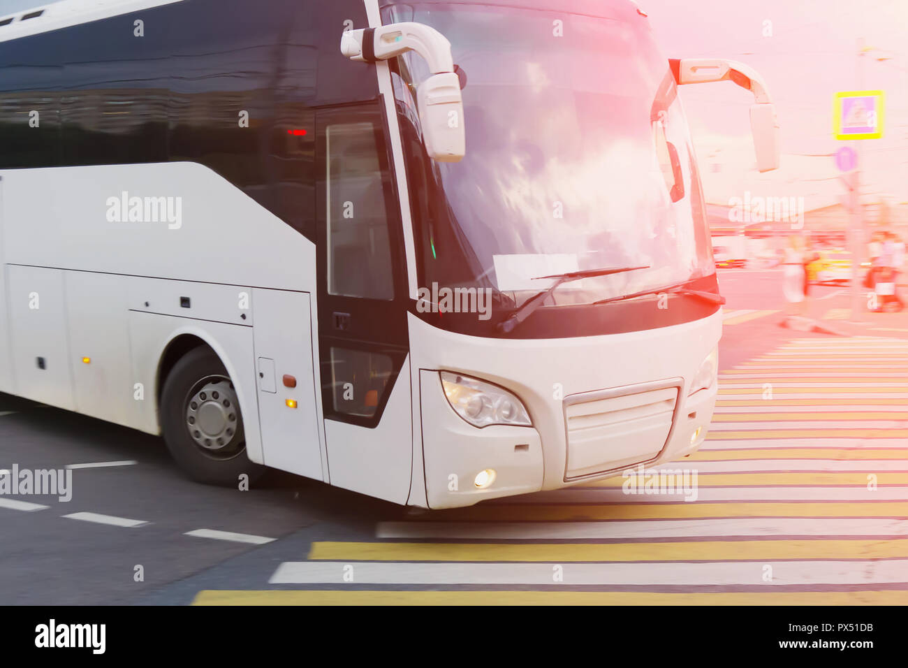 tourist bus at the city intersection Stock Photo - Alamy