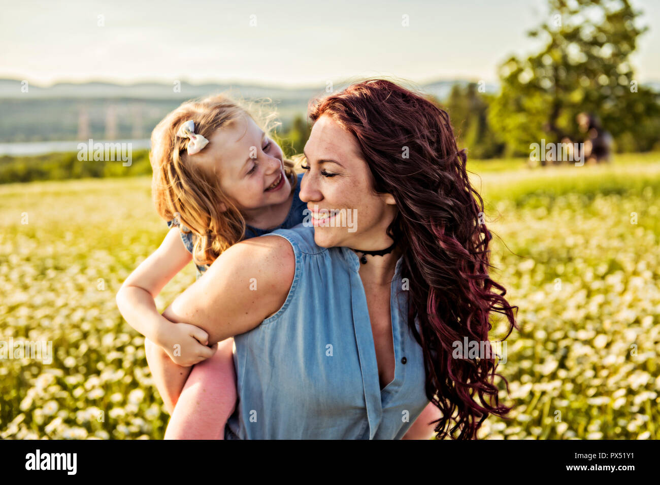 Mother spending time with daughter during the sunset Stock Photo - Alamy