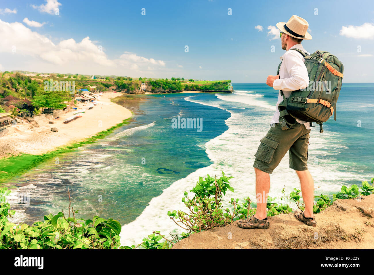 Travel Lifestyle and Success concept: Travel man backpacker on a top of ...