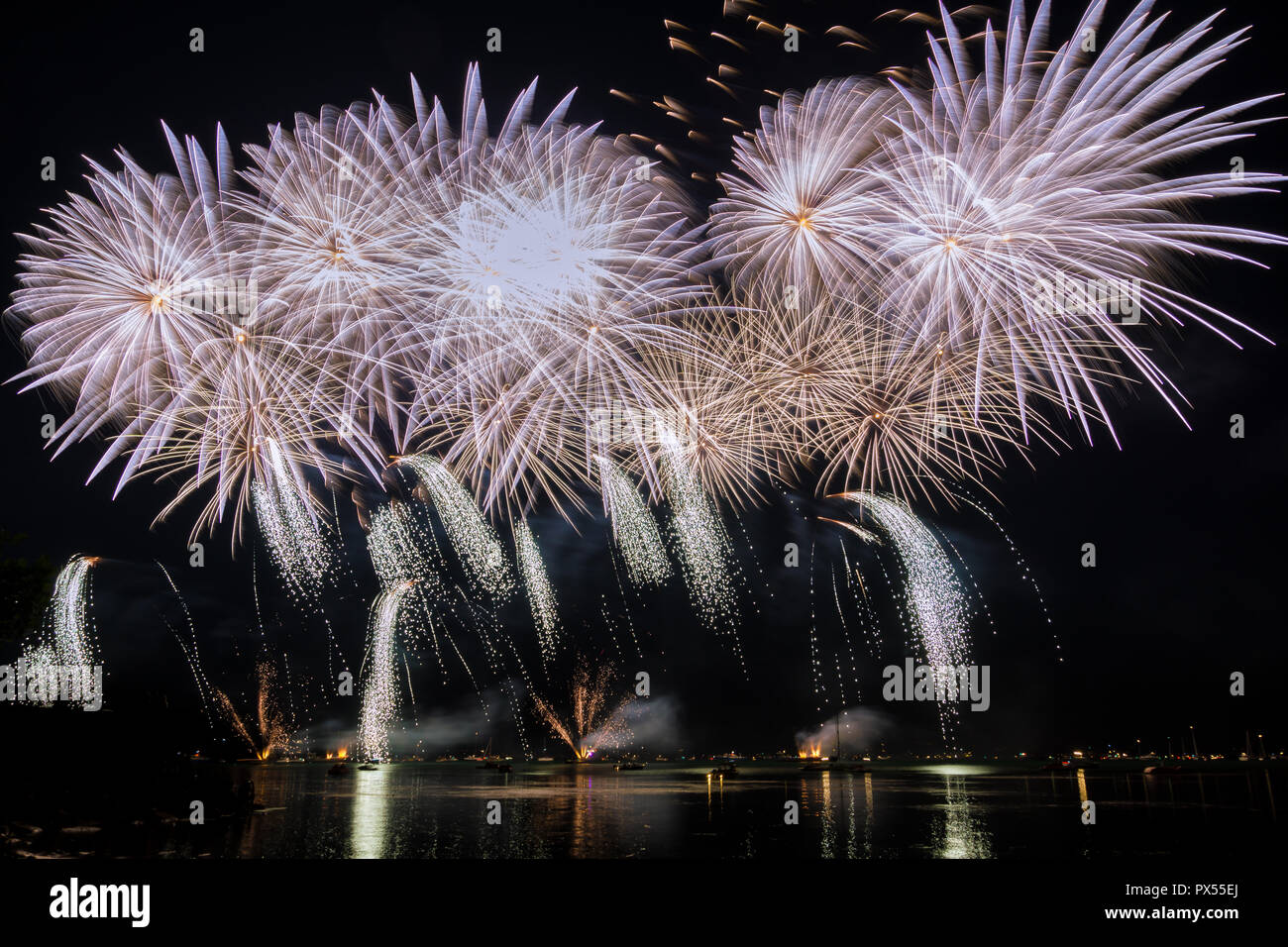 Giant fireworks display with many explosion on night sky Stock Photo ...