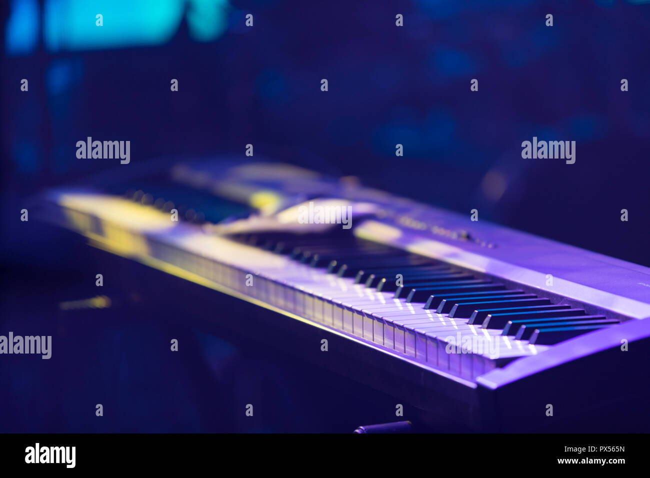 A synthesizer illuminated by stage lights Stock Photo - Alamy