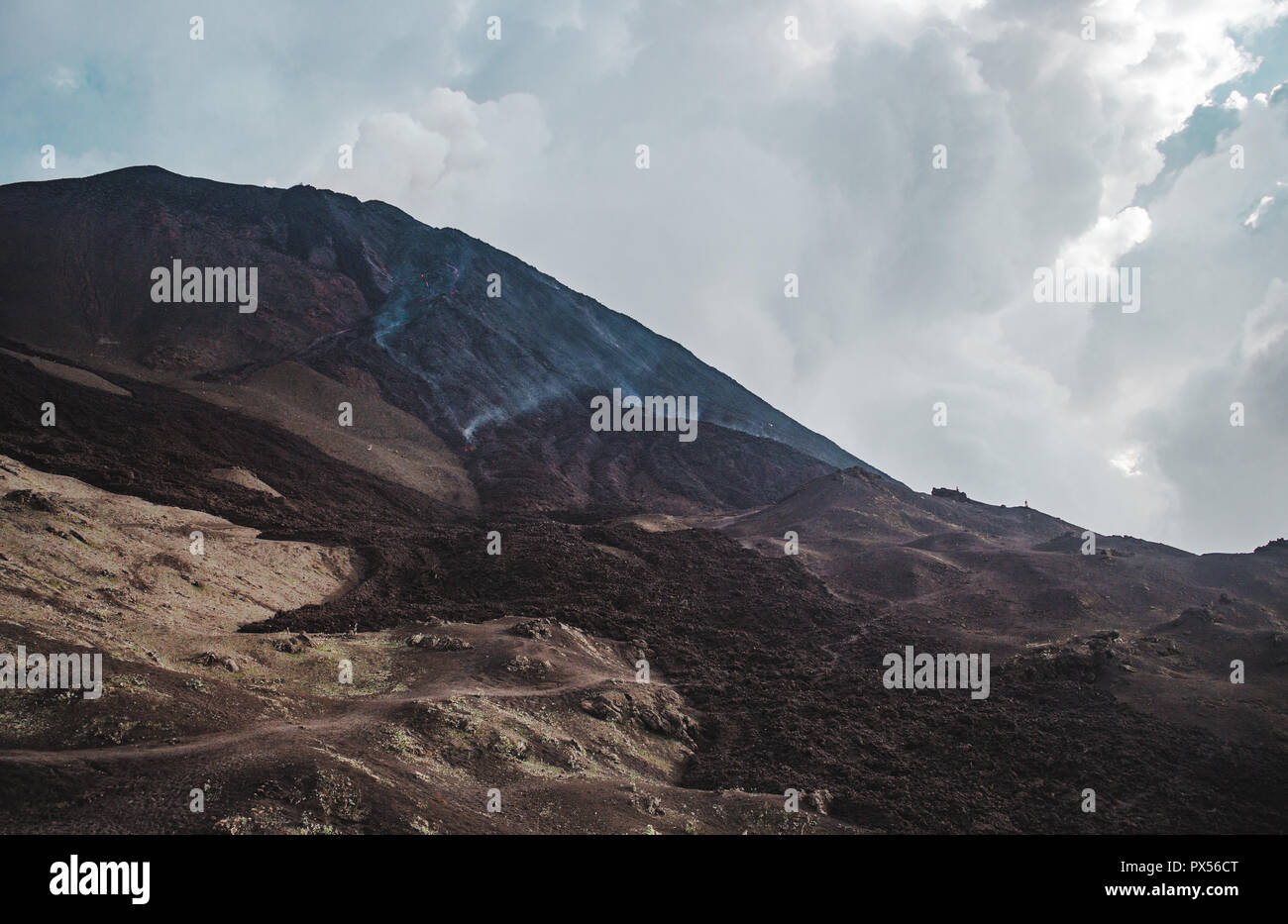 Small volcanic rock and lava flow down Pacaya Volcano, one of Guatemala ...