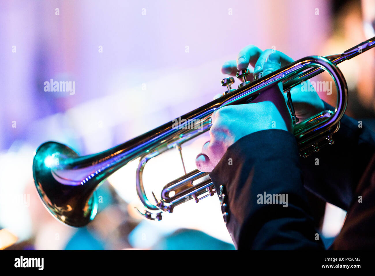 A person playing a trumpet during a concert Stock Photo - Alamy