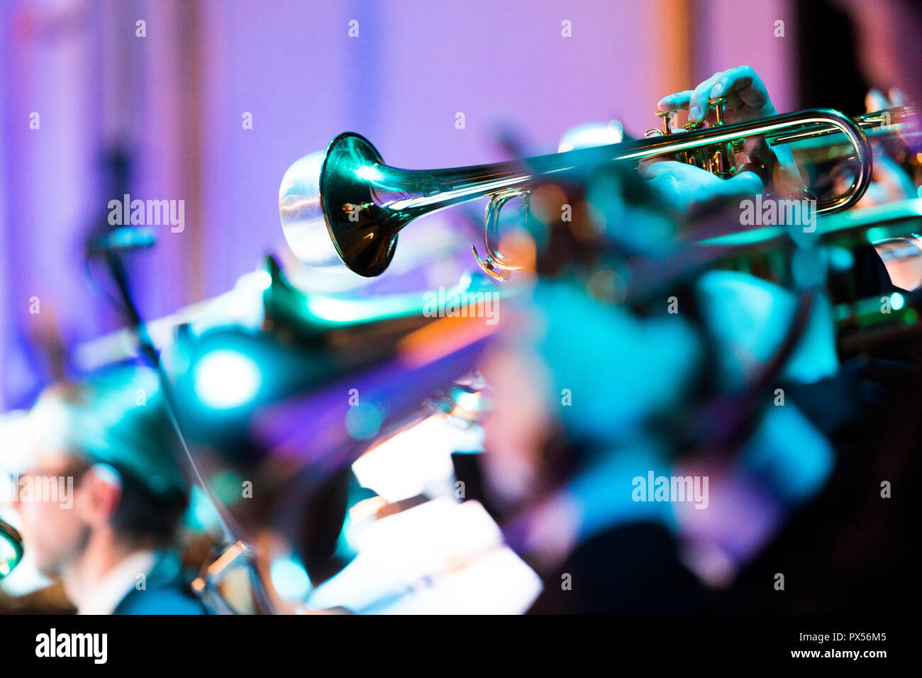 A person playing a trumpet with a mute during a concert Stock Photo - Alamy