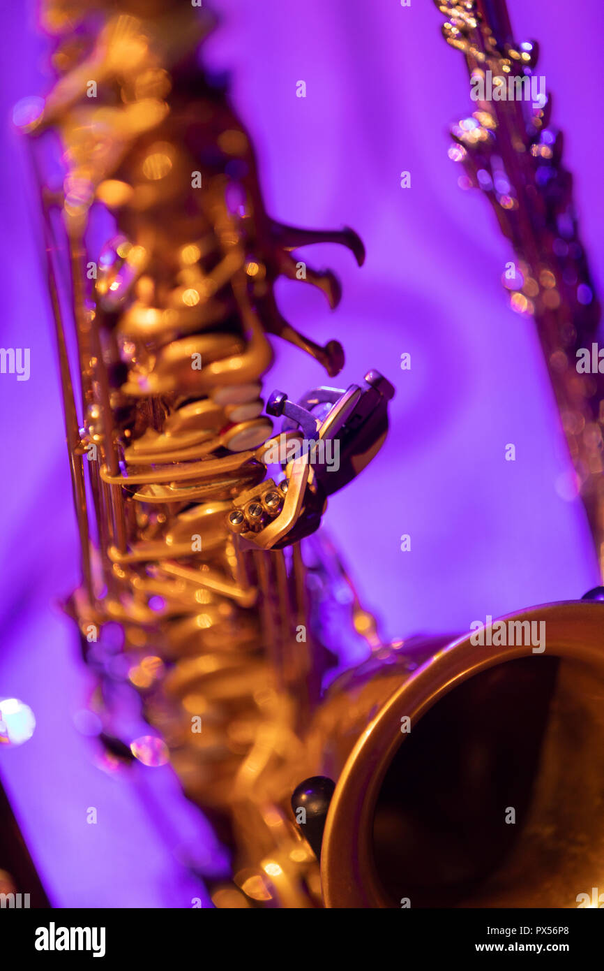 A raw brass saxophone in stage lights Stock Photo - Alamy