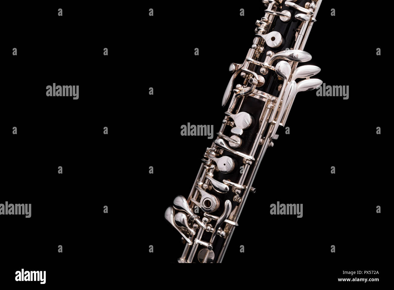 A black oboe with silver plated keys on a black background Stock Photo ...