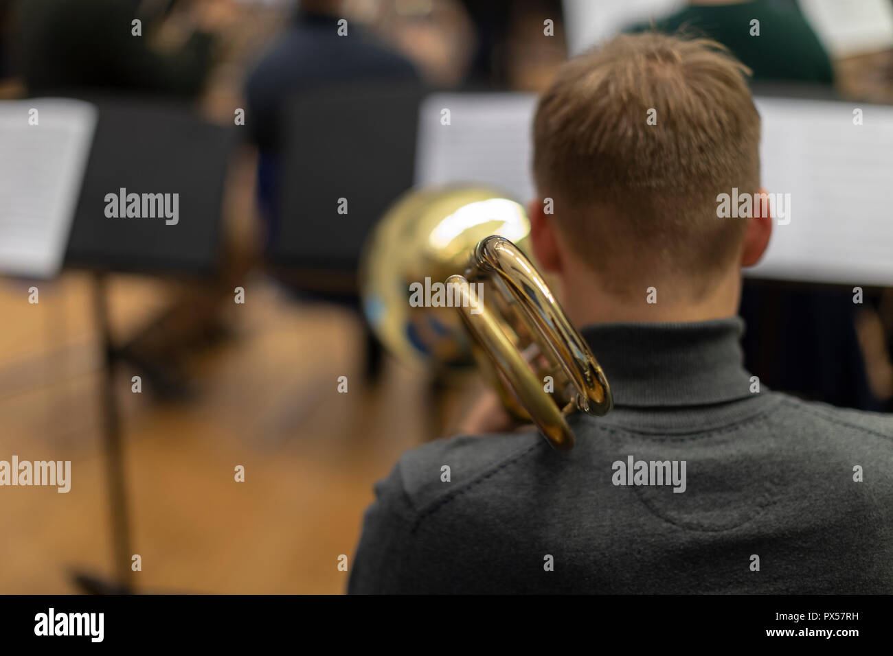 A person playing a trombone in rehearsal Stock Photo - Alamy