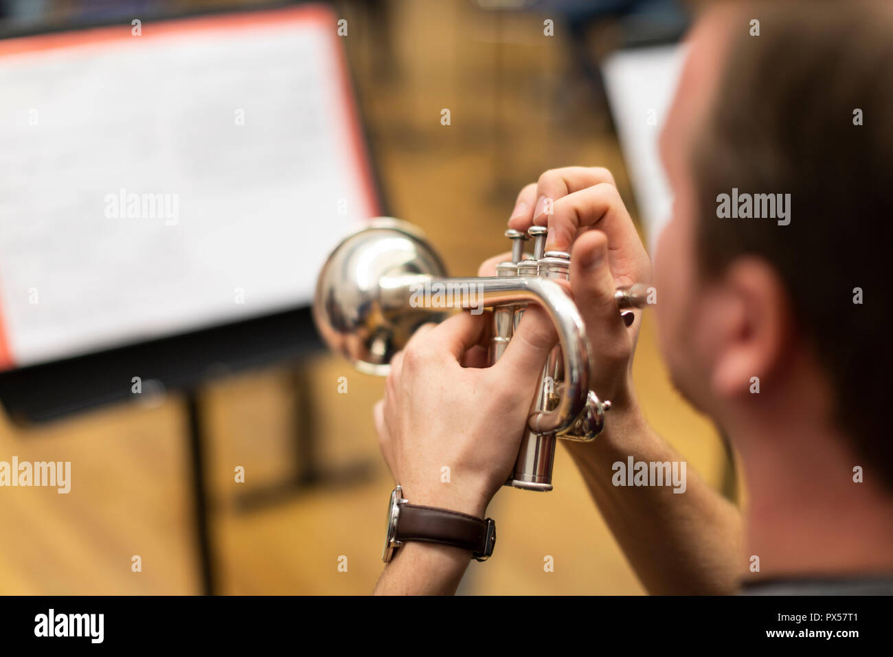 A person playing a trumpet in rehearsal Stock Photo - Alamy