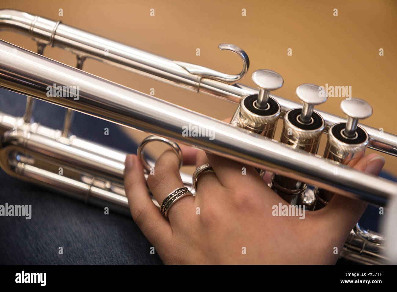Hand holding trumpet hi-res stock photography and images - Alamy