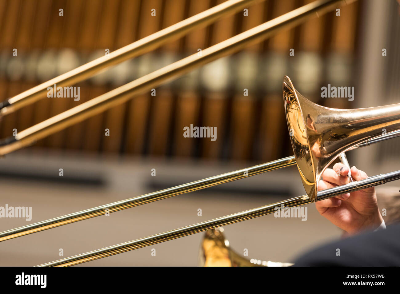 People playing trombones during a concert Stock Photo - Alamy